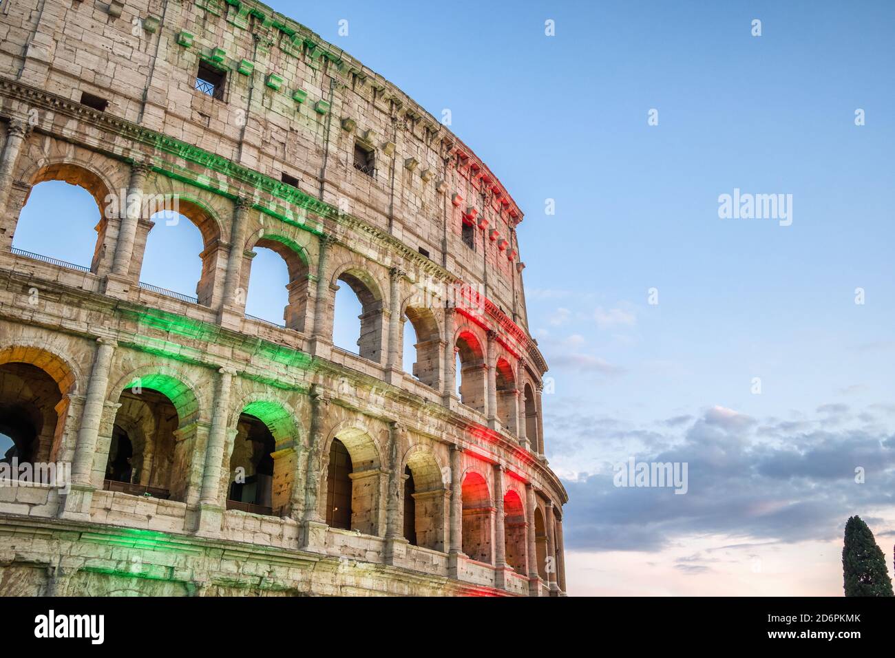 The famous Colosseum in Rome illuminated in Italian flag tricolore at ...