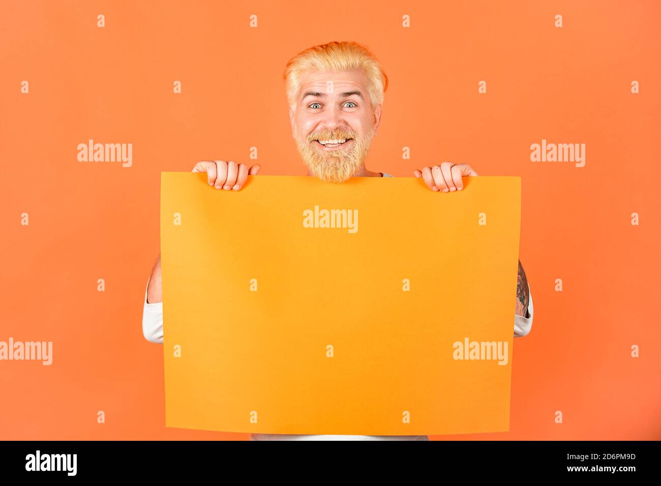Man holding empty sheet of a paper. Man holding blank card. Man show ...
