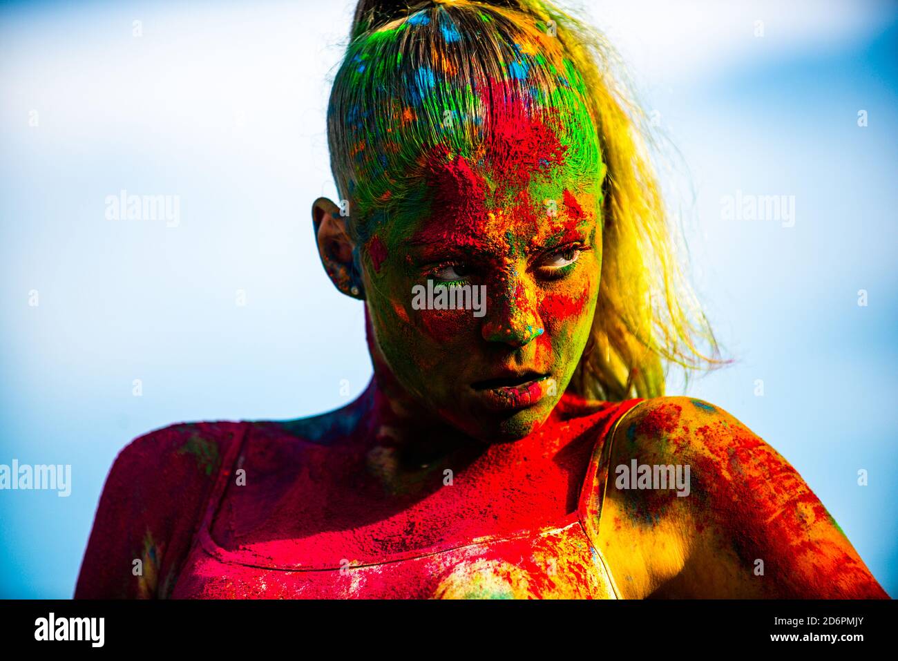 High fashion model girl portrait with colorful powder make up. Beauty ...