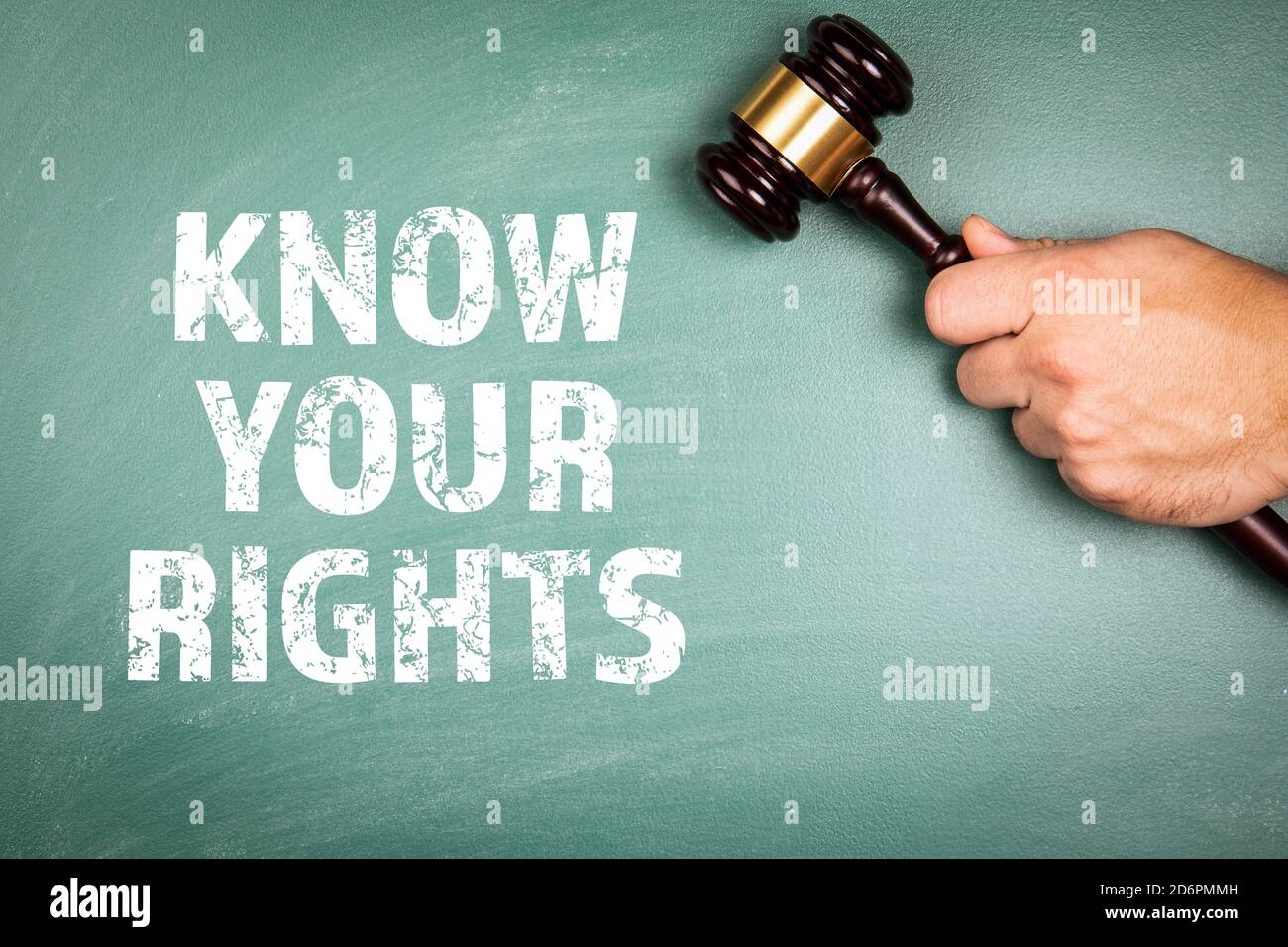 KNOW YOUR RIGHTS. In the hand of a judge's wooden hammer. Green chalk ...