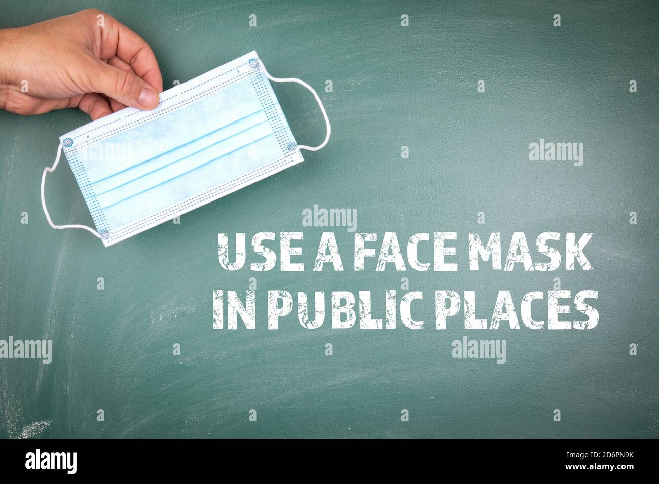 Use a face mask in public places. Green chalk board background Stock ...