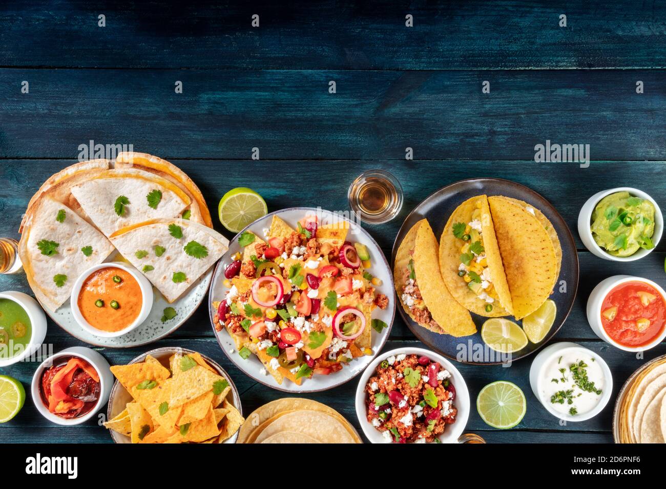 Mexican food background with copy space. Many various dishes, overhead ...