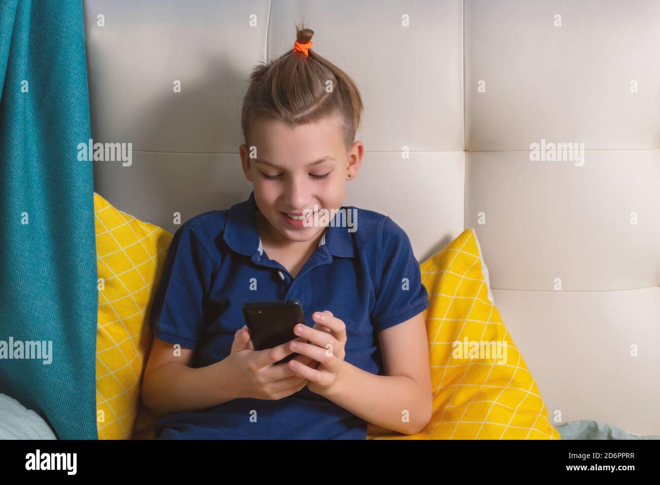 Teen boy talking on smartphone hi-res stock photography and images - Alamy
