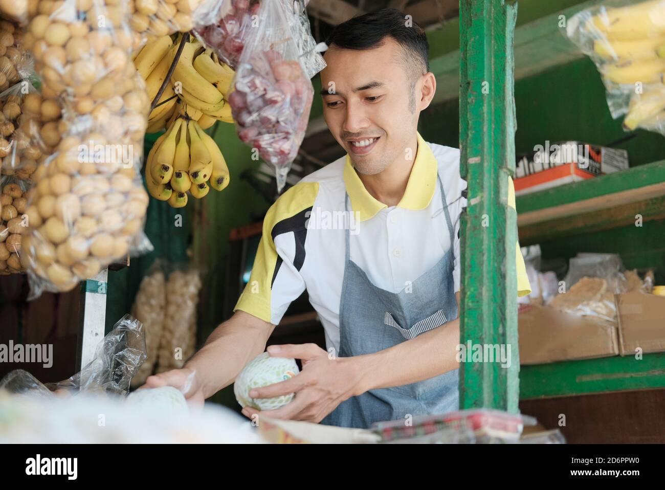 Young single man work at fruits and vegetables store Stock Photo - Alamy