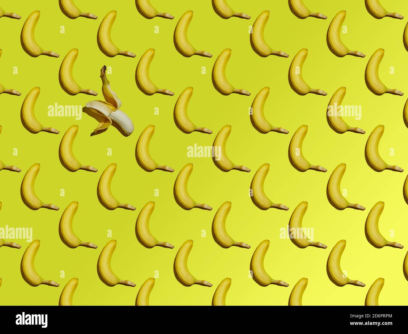 A pattern from a whole ripe bananas isolated on a yellow gradient ...