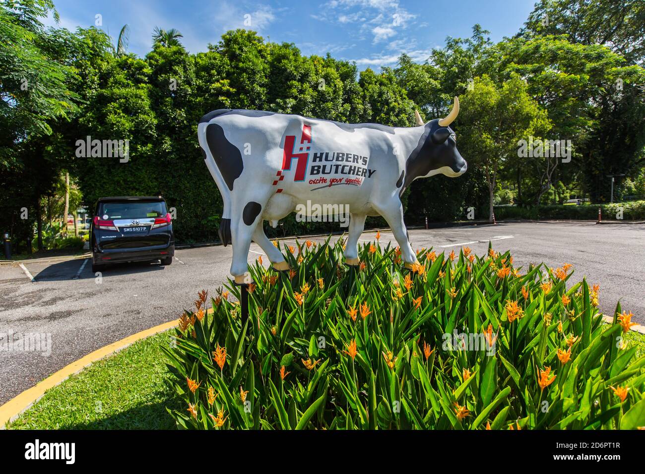 Huber's butchery life-size cow display outdoor with greenery ...