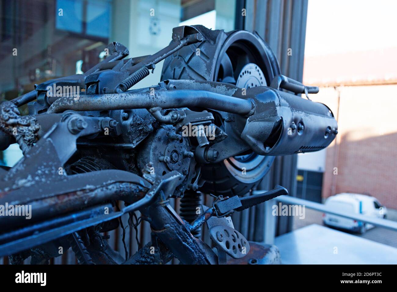 crashed and broken moped placed upside down Stock Photo - Alamy