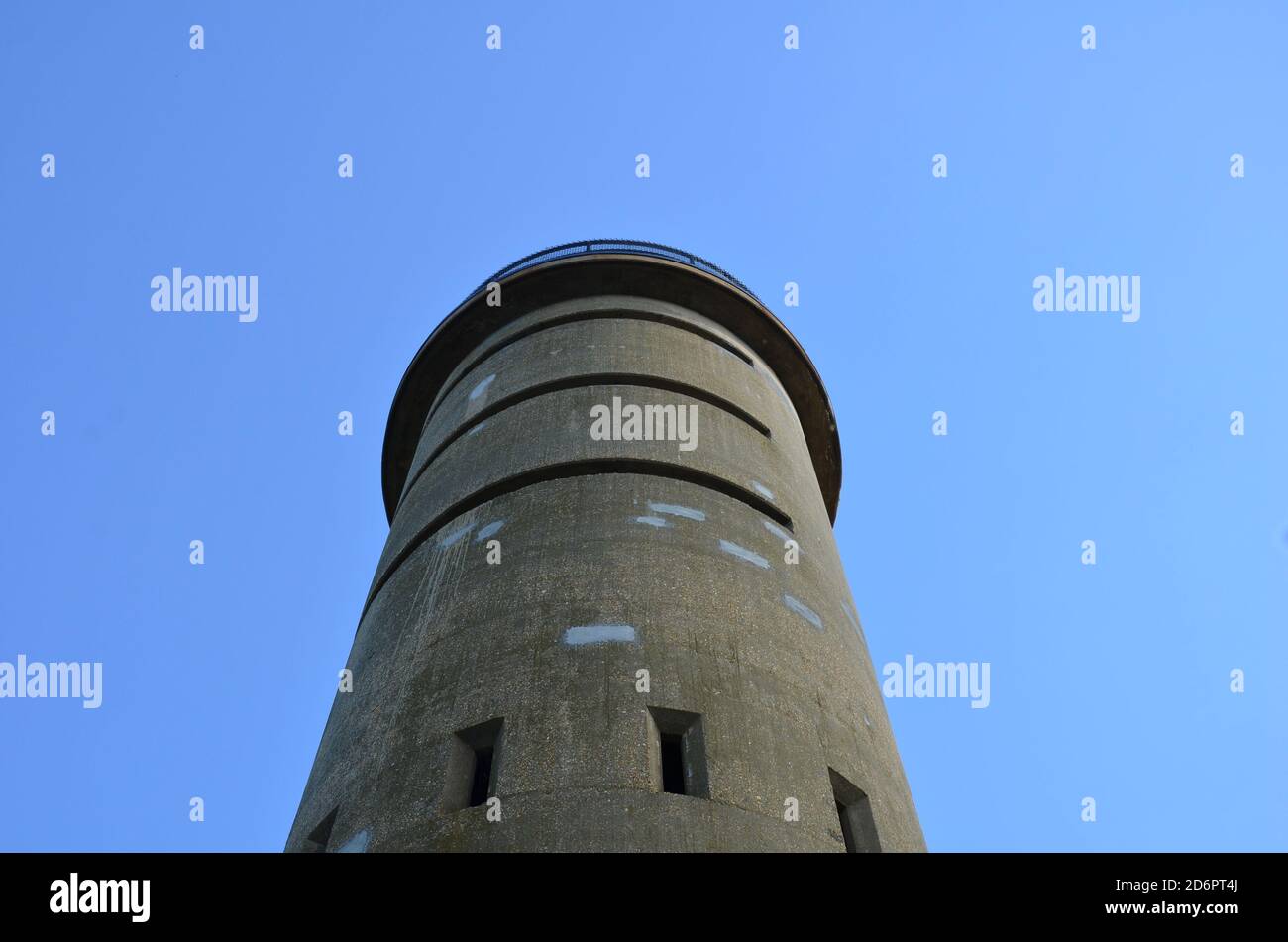 tall cement tower structure or building with blue sky Stock Photo - Alamy