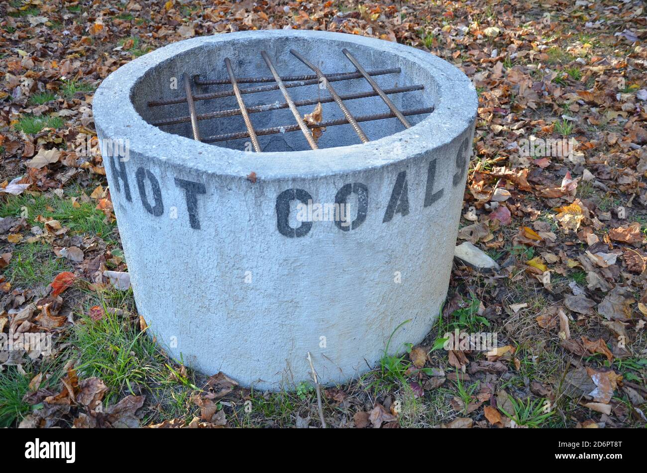 cement hot coal container or bin with metal bars and leaves Stock Photo ...