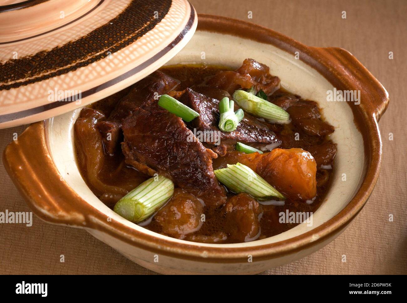 Stewed assorted meats and sea cucumber in clay pot Stock Photo - Alamy