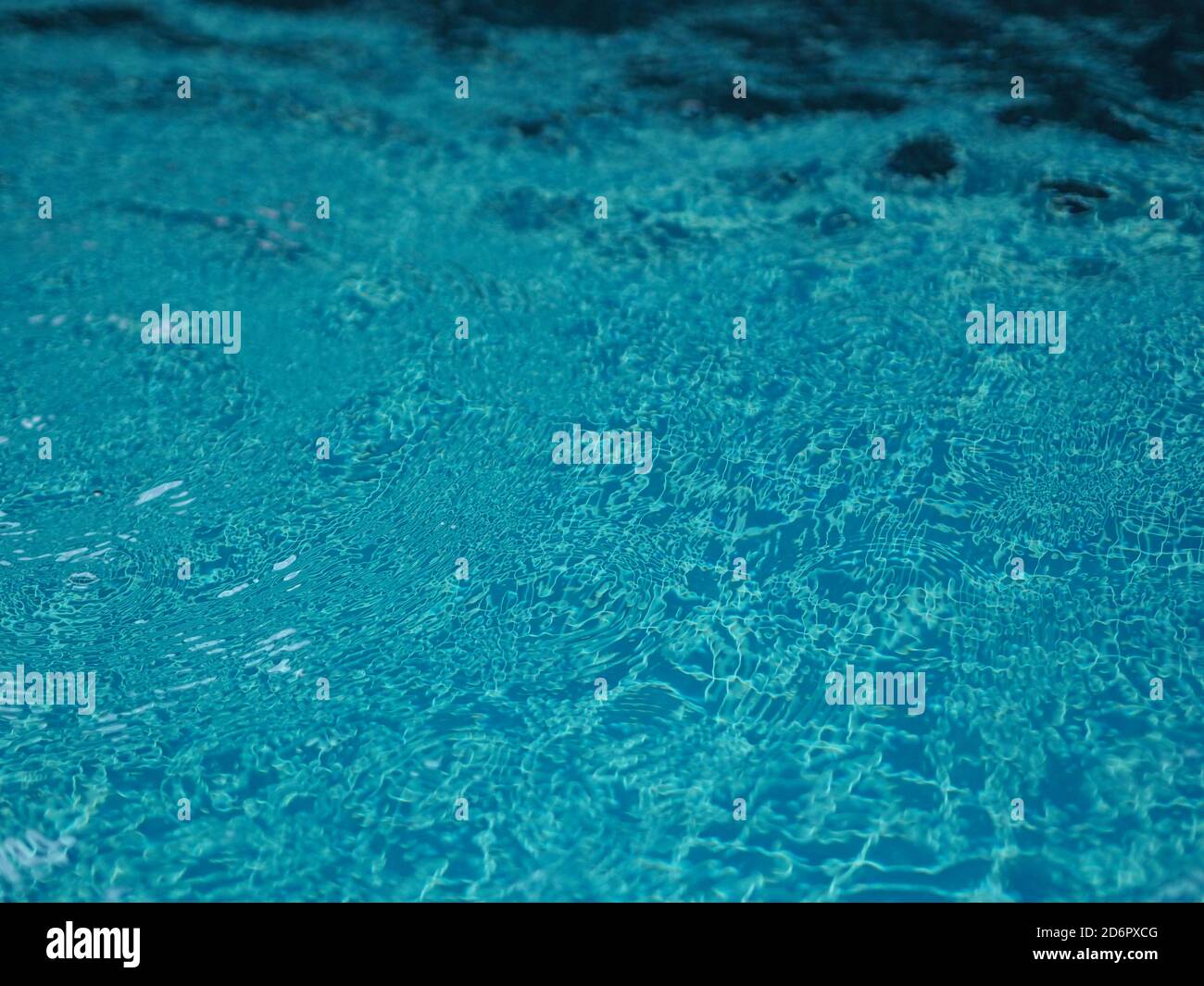 blue water in pool background ripples on the surface texture, glittering bokeh abstract Stock ...