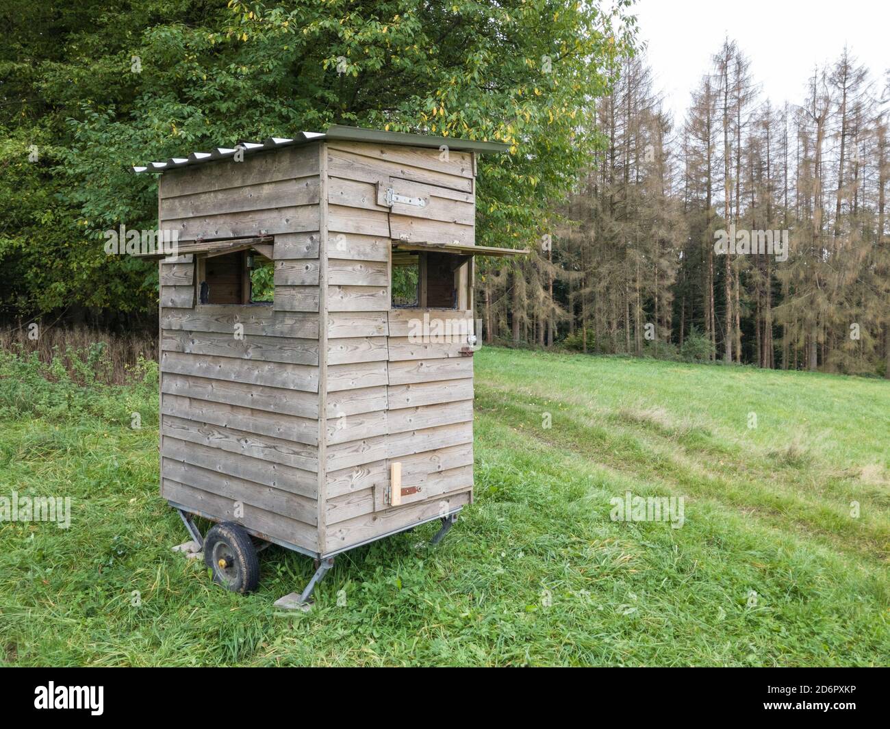 Wooden hide, made of planks with open windows, for hunters and hunting ...