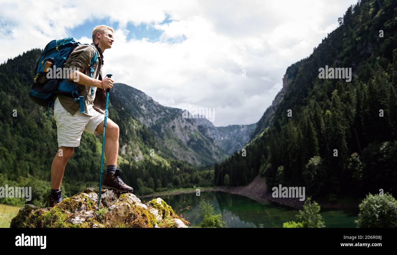 Young hiker man trekking in hi-res stock photography and images - Alamy