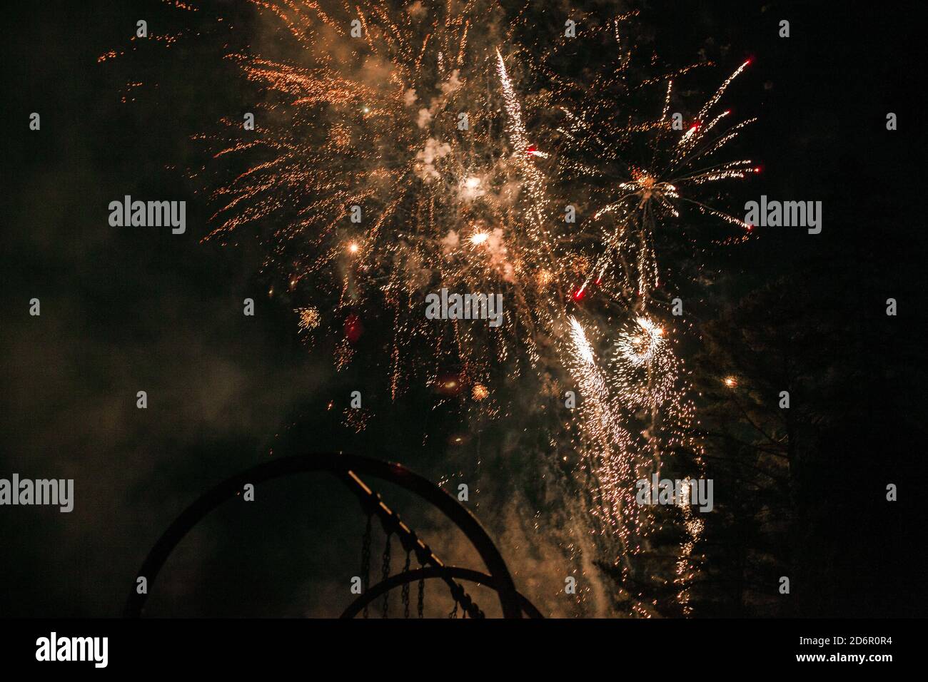 Bright fireworks in the dark night sky Stock Photo - Alamy