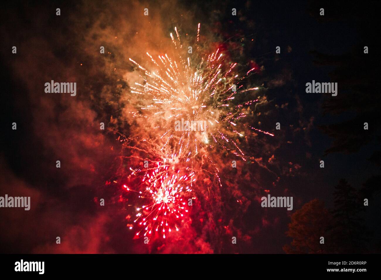 Bright fireworks in the dark night sky Stock Photo - Alamy