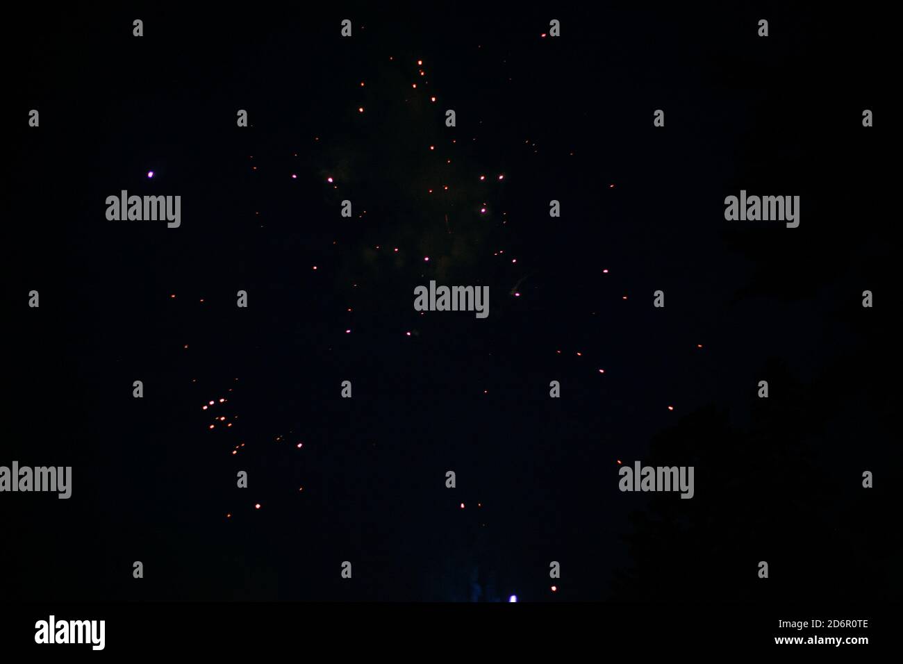 Lights of the unexploded firework in the dark sky Stock Photo - Alamy