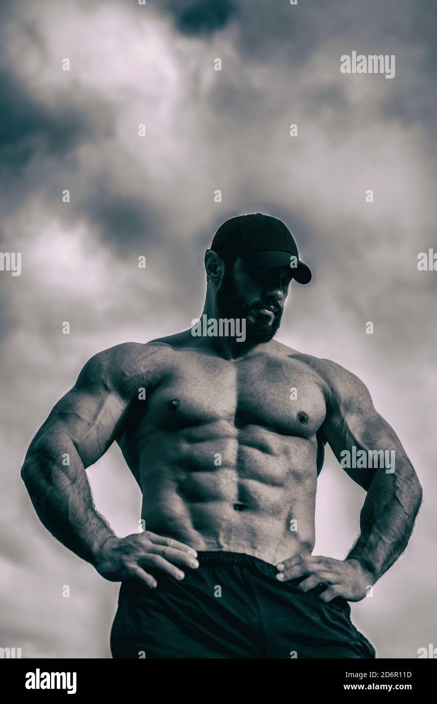 strong young sport bearded man with perfect athlete physique body on ...
