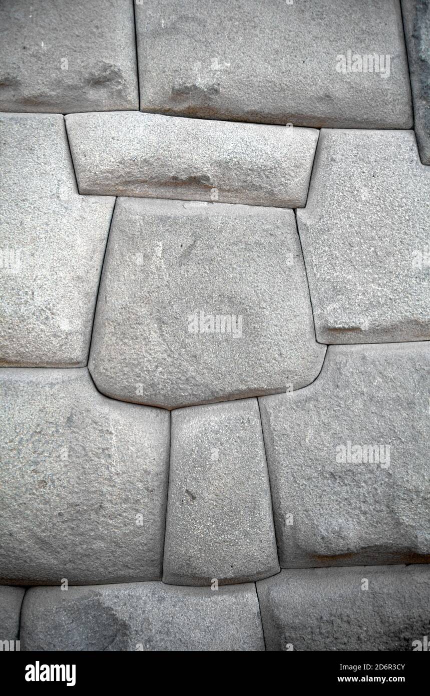 Made by the Incas, massive stone blocks form walls that still line some ...