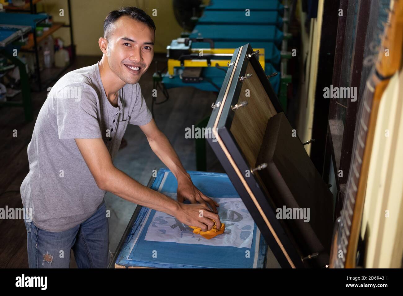 Smiling man when man preparing manual screen printing shirt Stock Photo ...