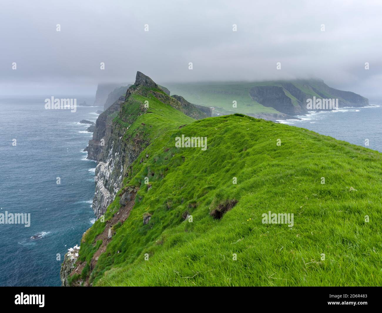 The island Mykines, seen from Mykinesholmur, part of the Faroe Islands ...