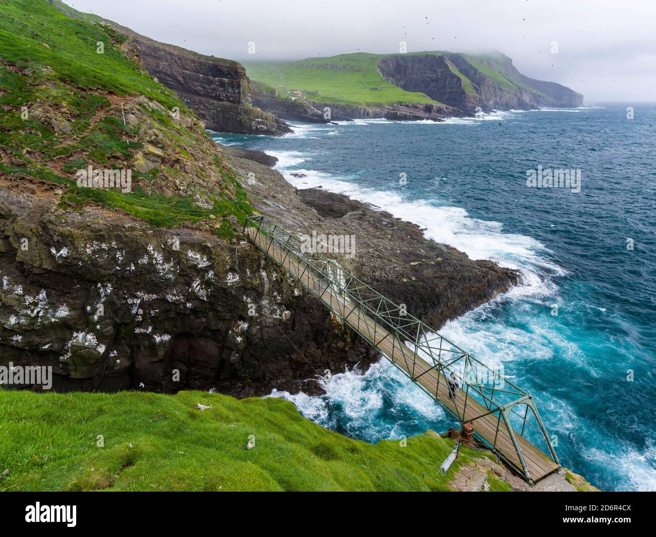 The bridge between mykinesholmur and Mykines. The island Mykines, part ...