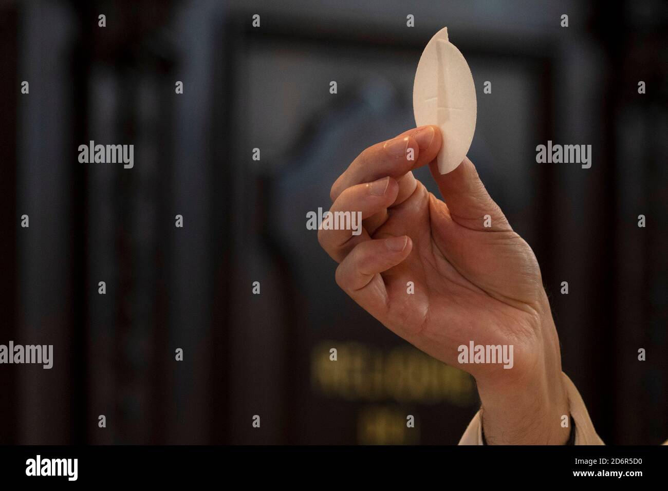 Holding communion host hi-res stock photography and images - Alamy