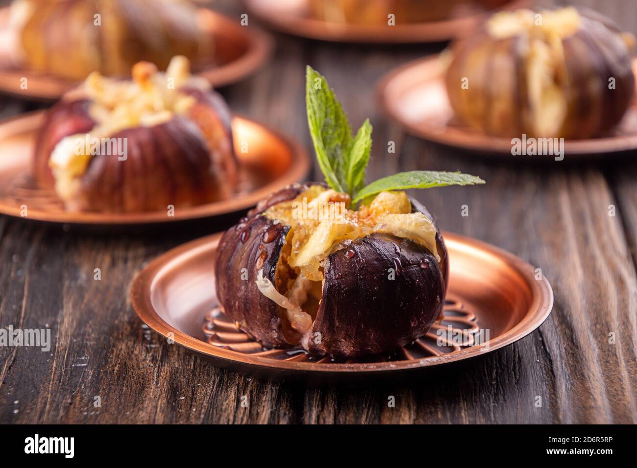 Ripe figs baked with cow's-milk cheese brie and camambert and sprinkled ...