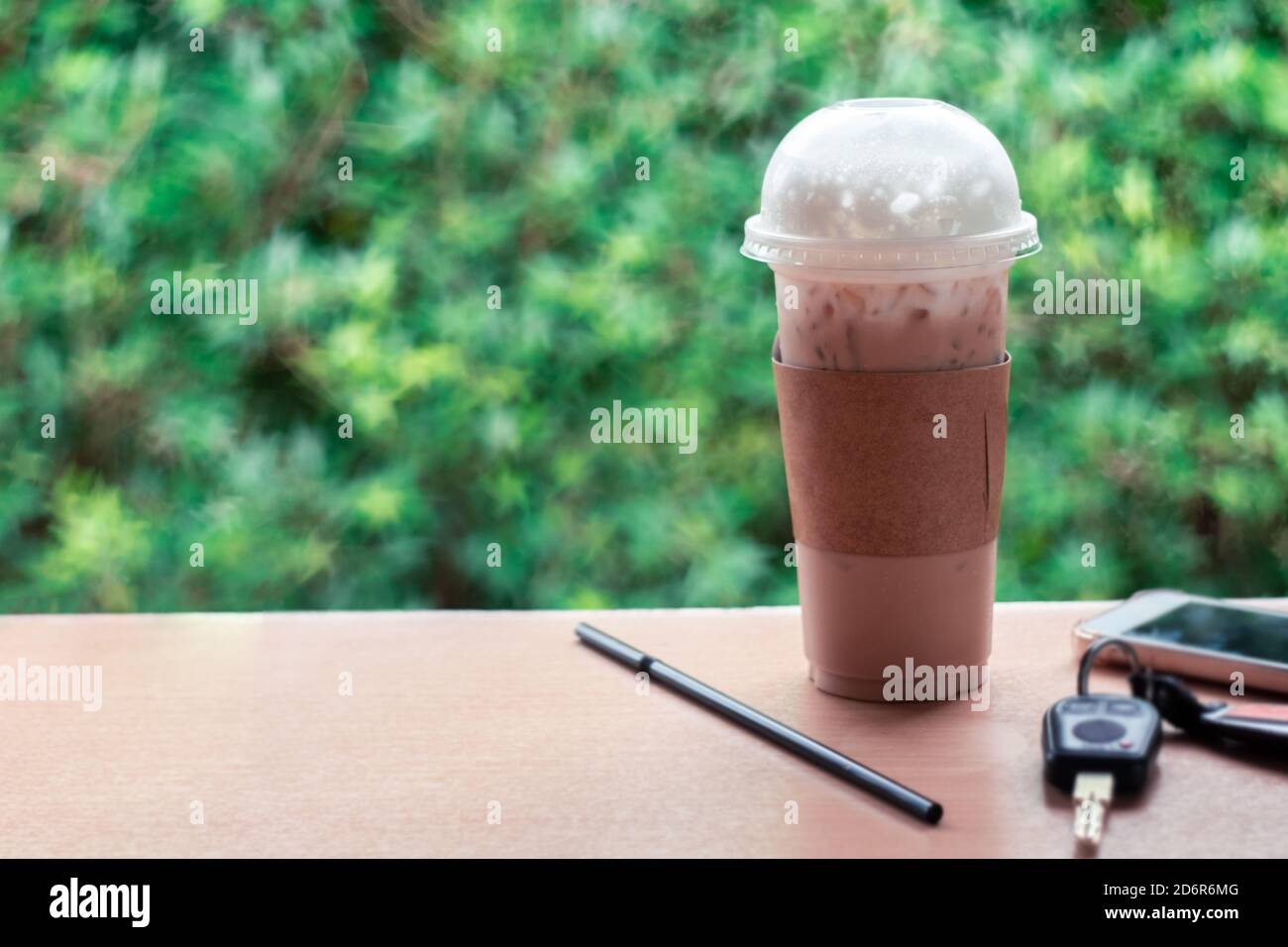 Ice coffee , Key and smartphone in cafe Stock Photo - Alamy