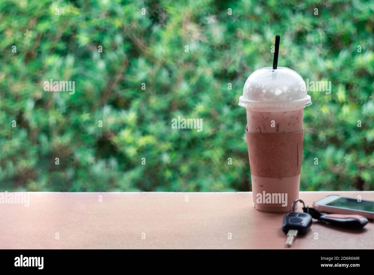 Ice coffee , Key and smartphone in cafe Stock Photo - Alamy