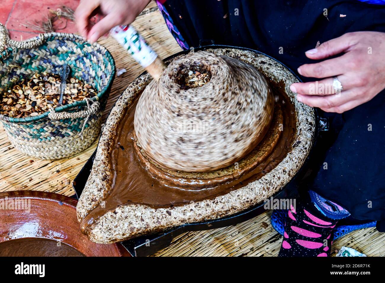 Argan oil extraction by traditional stone handmill mill Stock Photo - Alamy