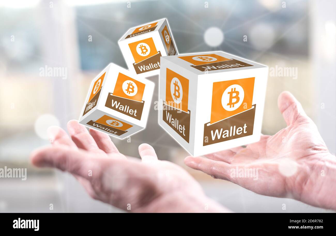 Bitcoin wallet concept above the hands of a man Stock Photo - Alamy