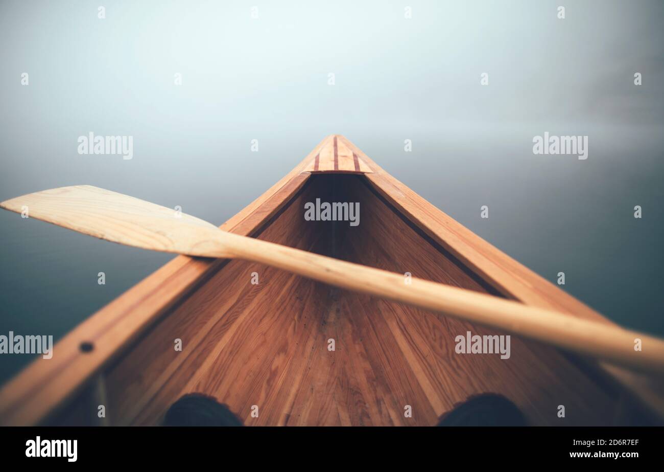 Winter canoeing. Canoe bow and paddle on the foggy lake Stock Photo - Alamy