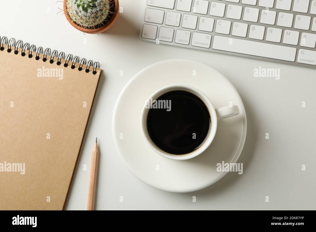 Workplace with cup of coffee on white background Stock Photo - Alamy