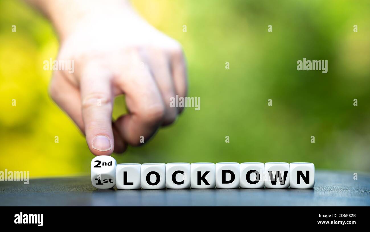 Symbol for a second lockdown. Hand turns dice and changes the ...