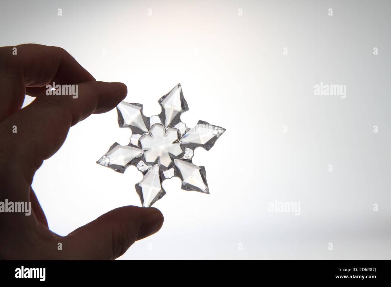 snoflake in the human hand isolated on the white background Stock Photo ...