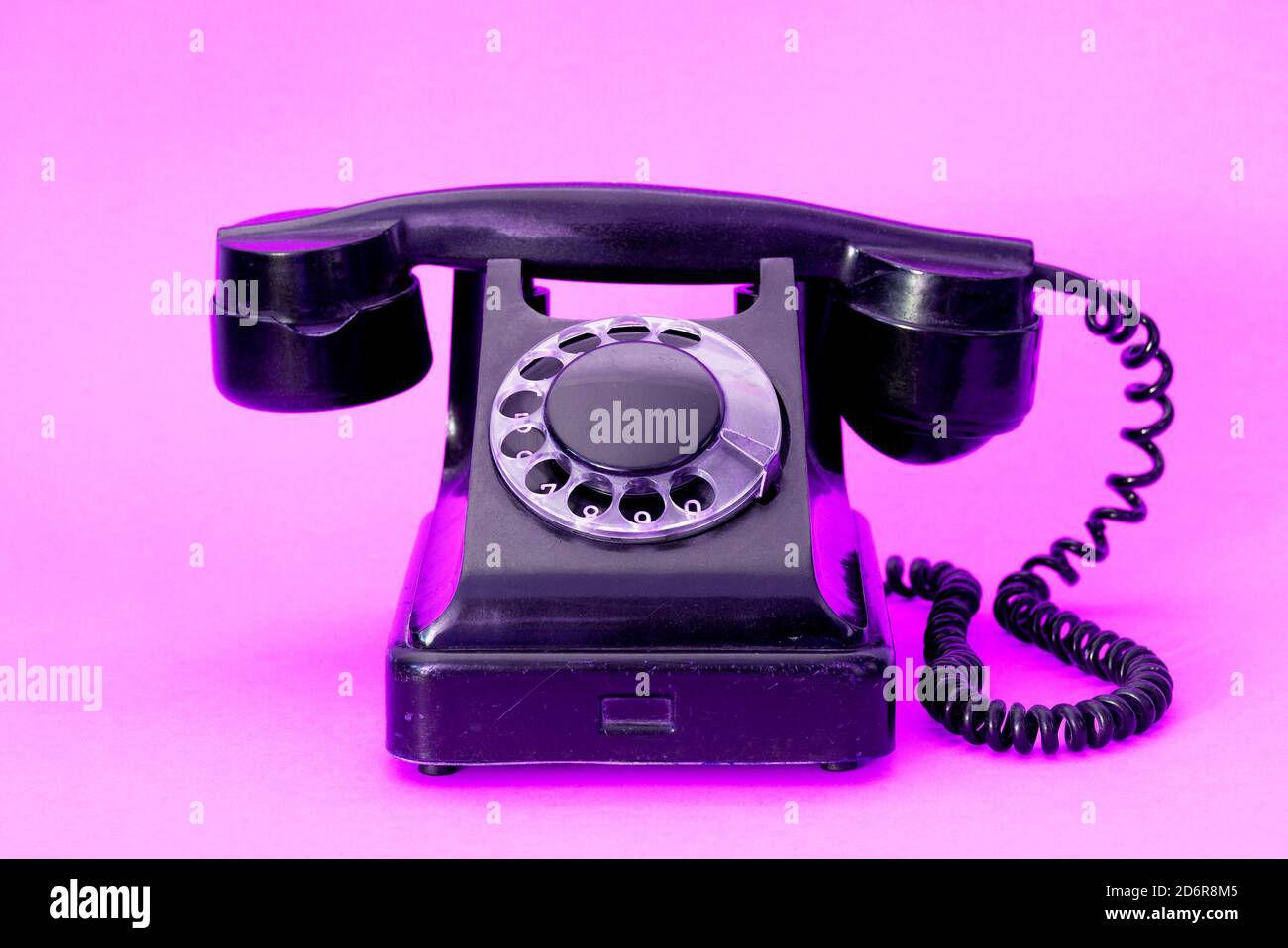 A vintage landline telephone on a colorful background Stock Photo - Alamy