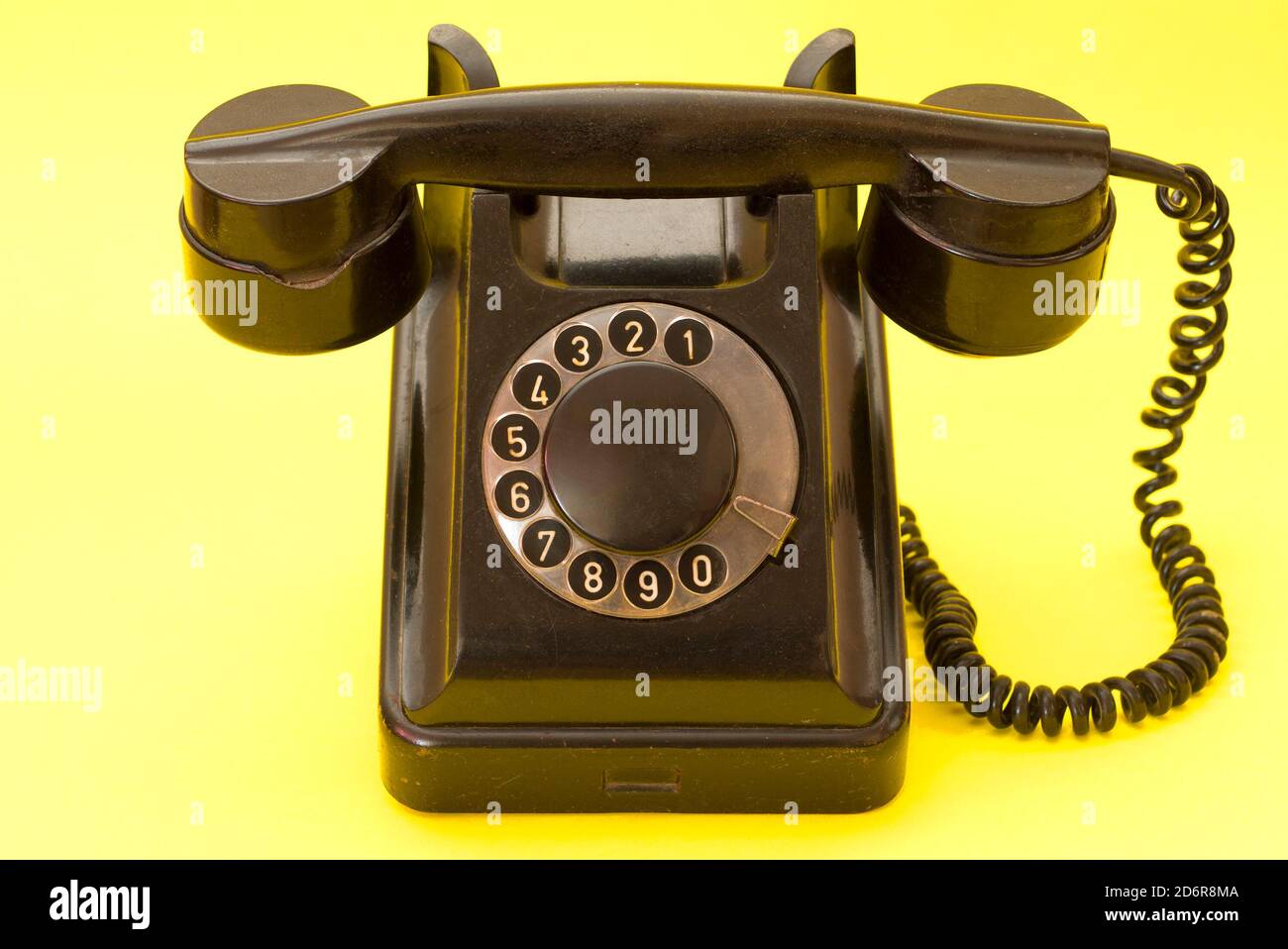 A vintage landline telephone on a colorful background Stock Photo - Alamy