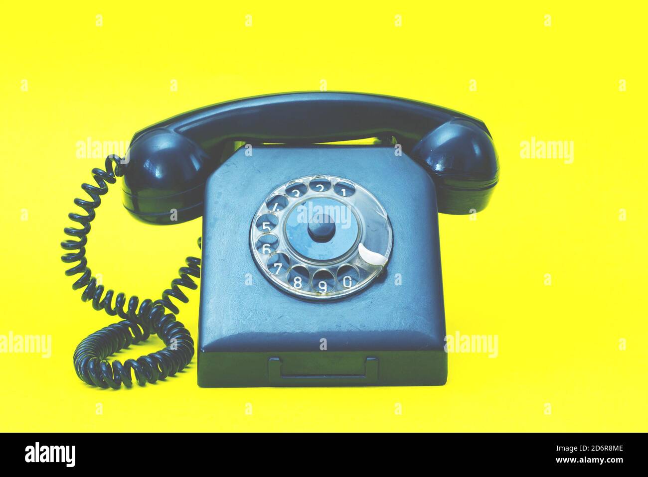 A vintage landline telephone on a colorful background Stock Photo - Alamy