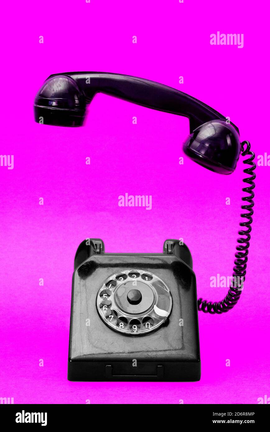 A vintage landline telephone on a colorful background Stock Photo - Alamy