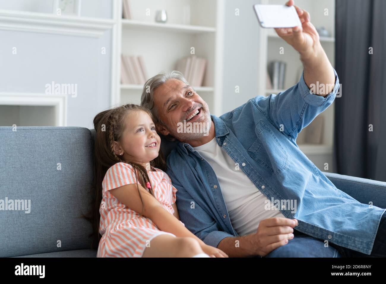 Funny selfie with dad. Self portrait of father and his little daughter ...
