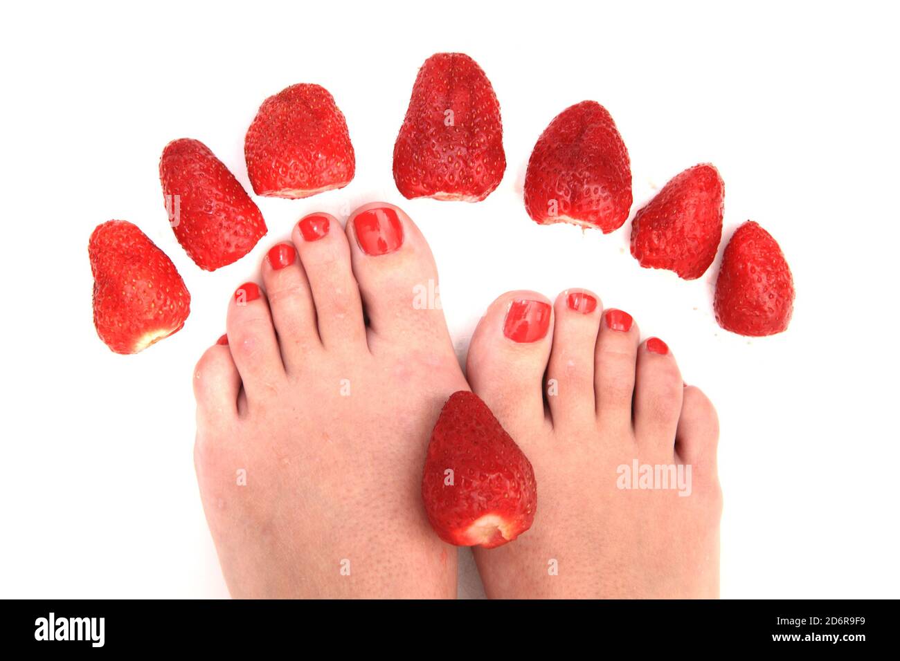 woman feet and strawberries isolated on the white background Stock ...