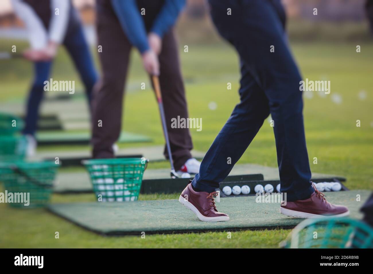 Golfers practicing driving range hi-res stock photography and images ...