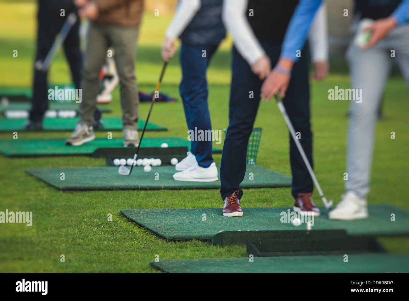 Golfers practicing driving range hi-res stock photography and images ...