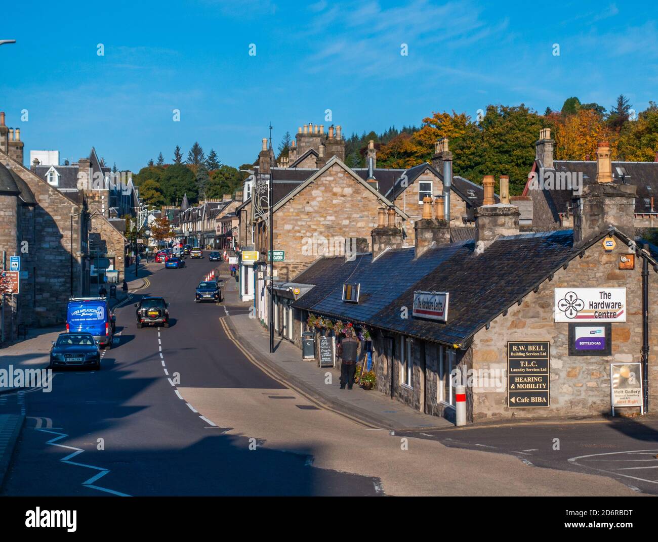 Shops, bars and restaurants in the main street in the town of Pitlochry ...