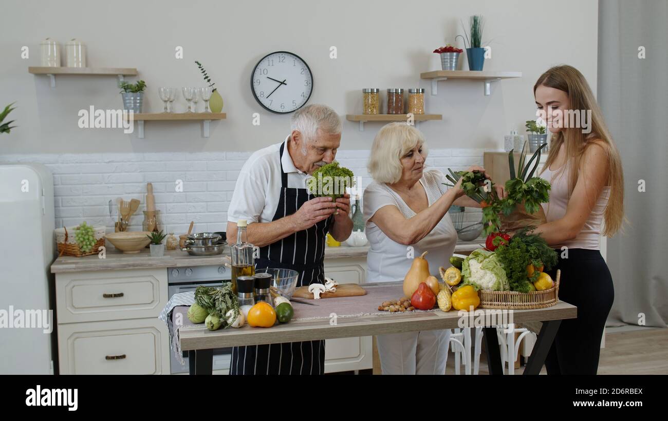 Elderly couple in modern kitchen interior. Grandmother and grandfather ...