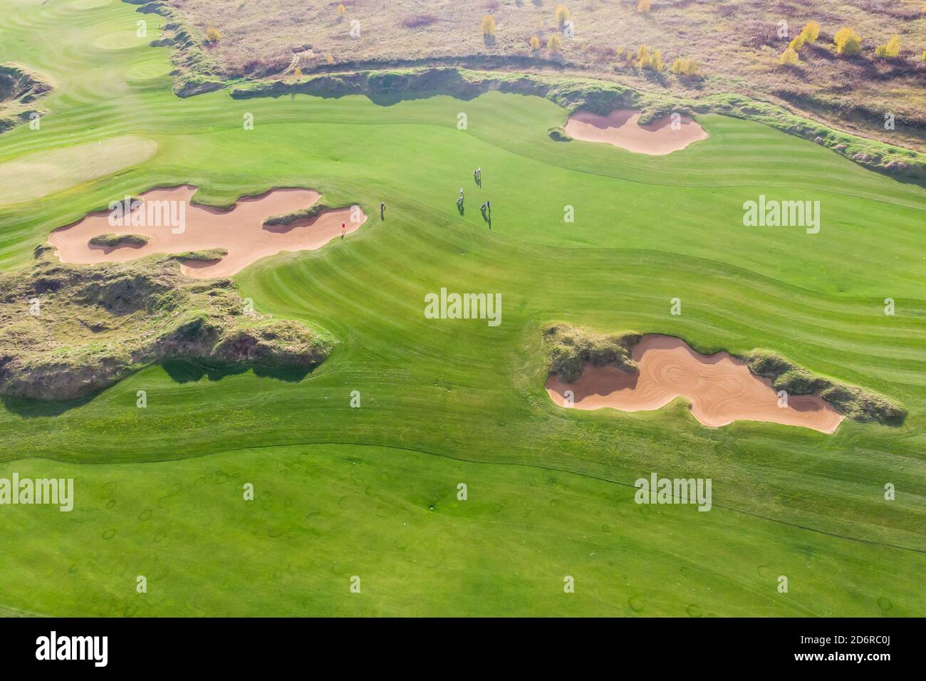 Aerial drone vibrant view of golf course in countryside, landscape ...