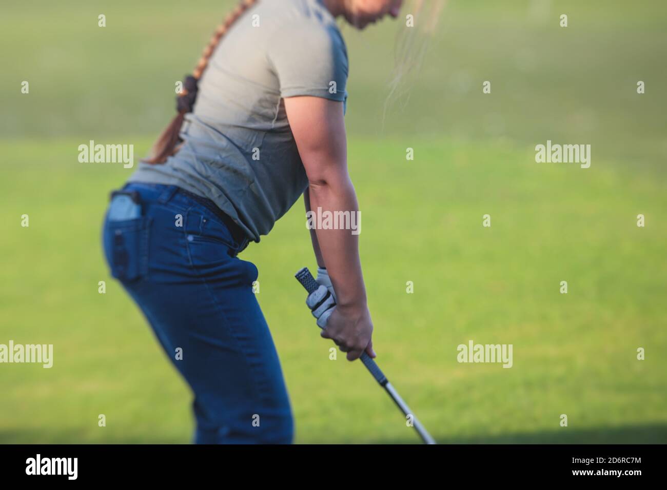Female golfer girl player practicing and training golf swing on driving ...