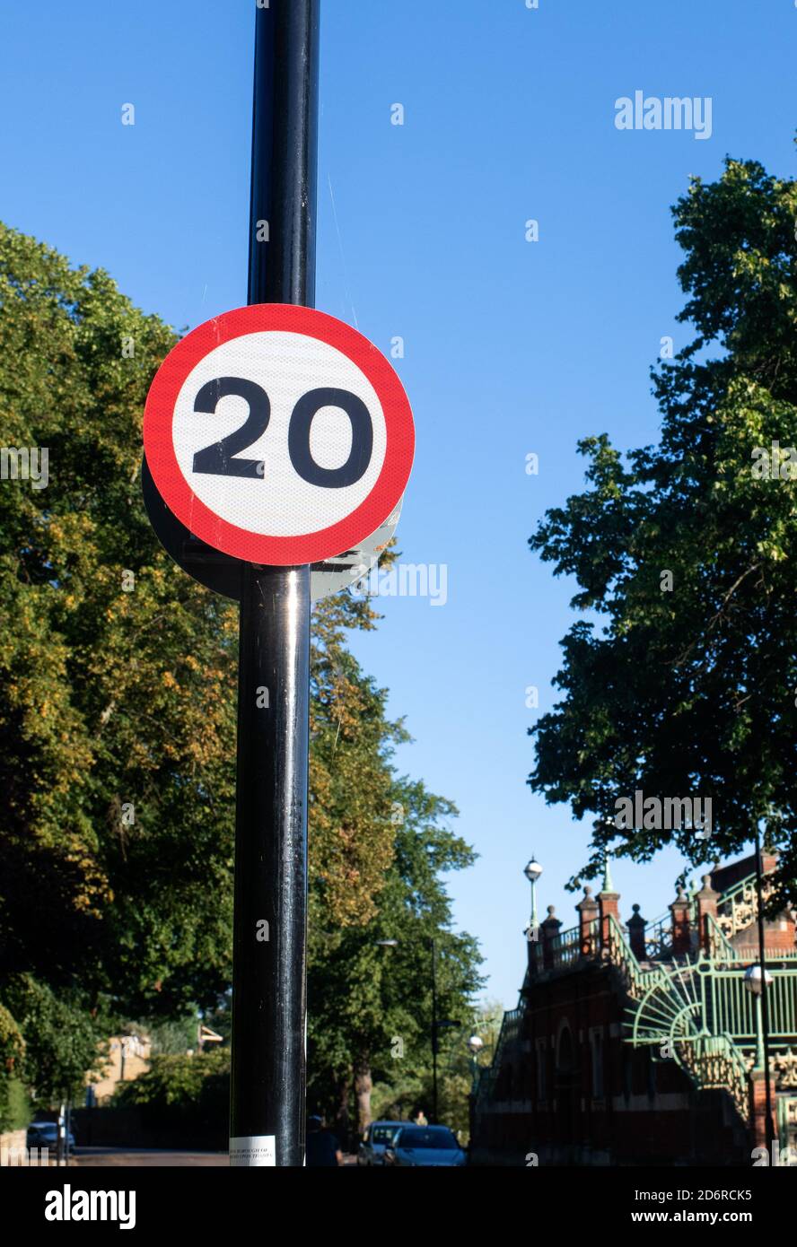 20 miles per hour road speed sign with blue sky Stock Photo - Alamy