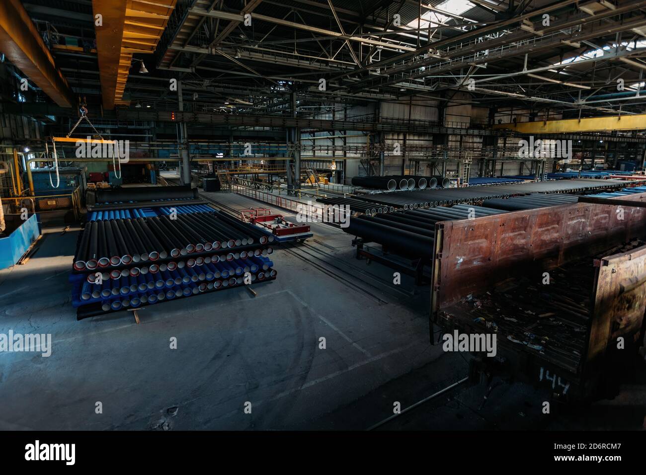 New cast iron pipes for pipeline construction in warehouse Stock Photo ...