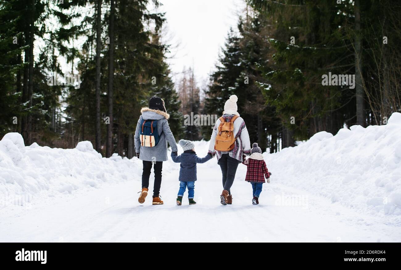 Girl with parents happy walking winter hi-res stock photography and ...